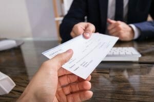 Understanding Why Banks Hold Checks - SmartAsset